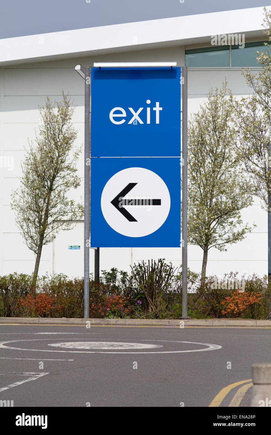 Exit sign with direction arrow from car park Stock Photo - Alamy