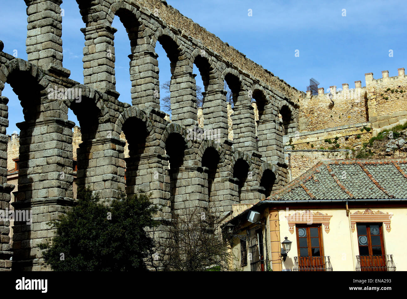 Ancient Aqueducts in Segovia Spain against a blue sky background Stock ...