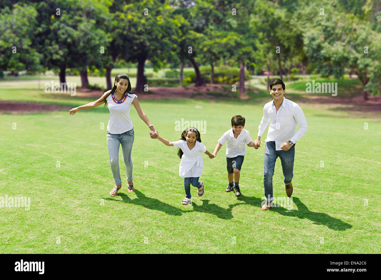 indian Parents and kids park Running Stock Photo - Alamy