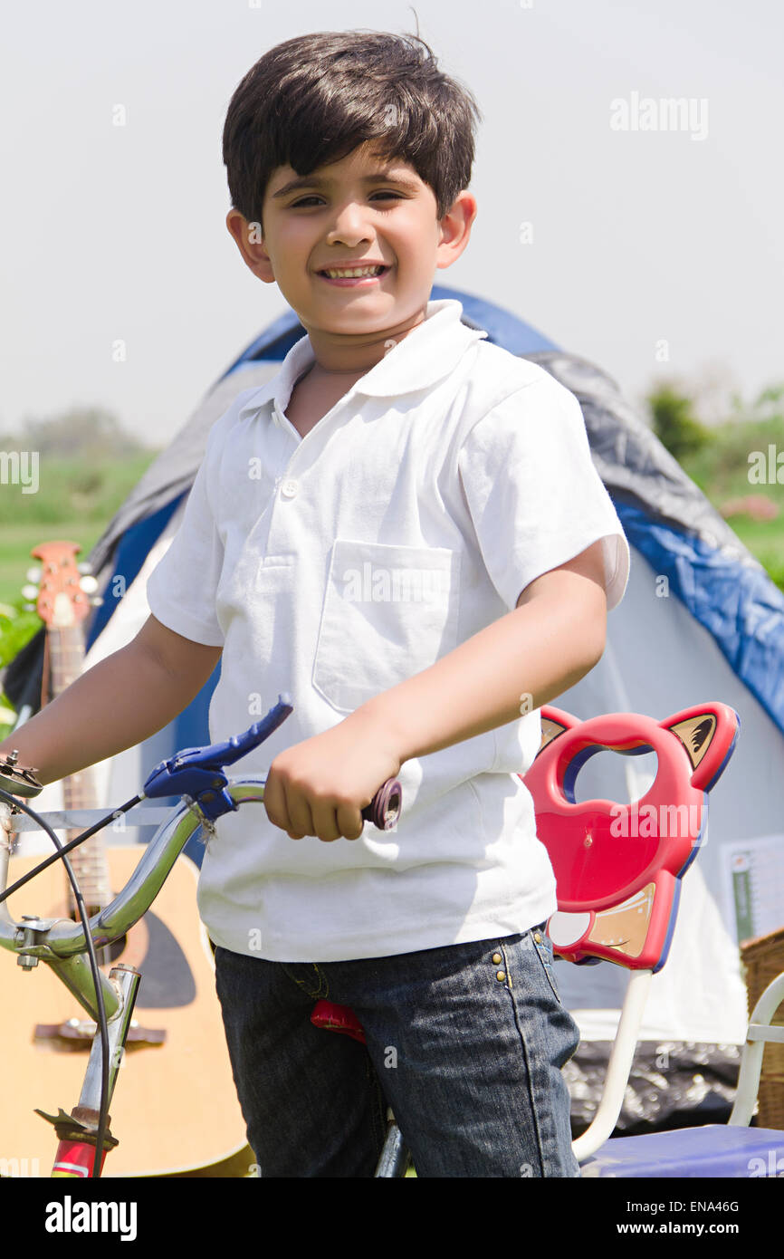 1 indian boy kid park Riding Cycle Stock Photo - Alamy