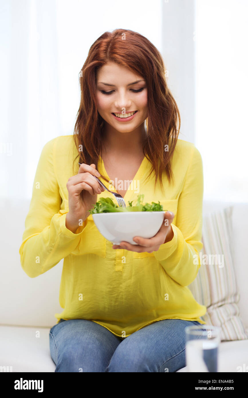 Woman eating salad laughing hi-res stock photography and images - Alamy