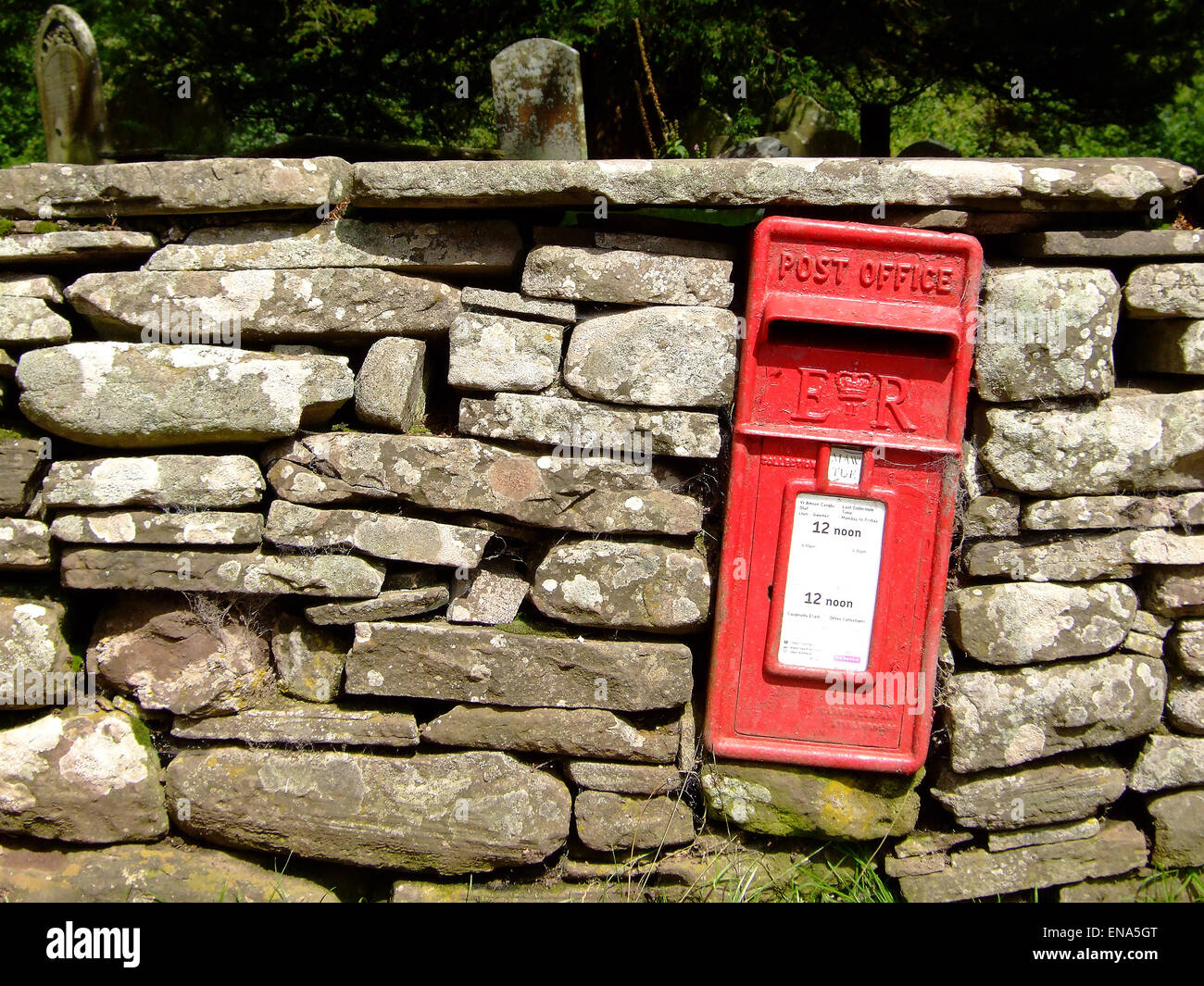 Classic British red royal mail box - English post box in stone wall ...