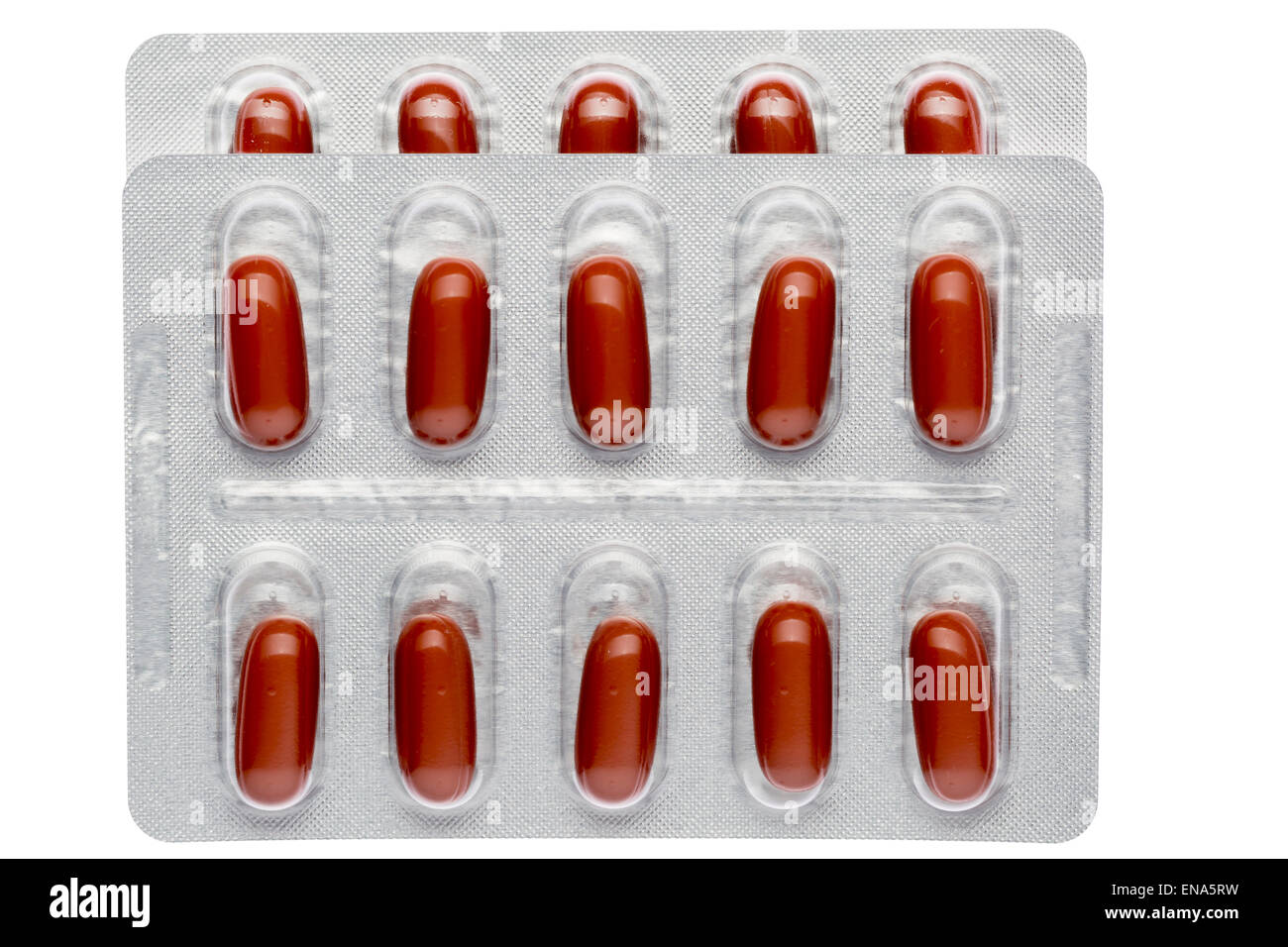 The 2x red capsules in a blister on isolated background Stock Photo - Alamy