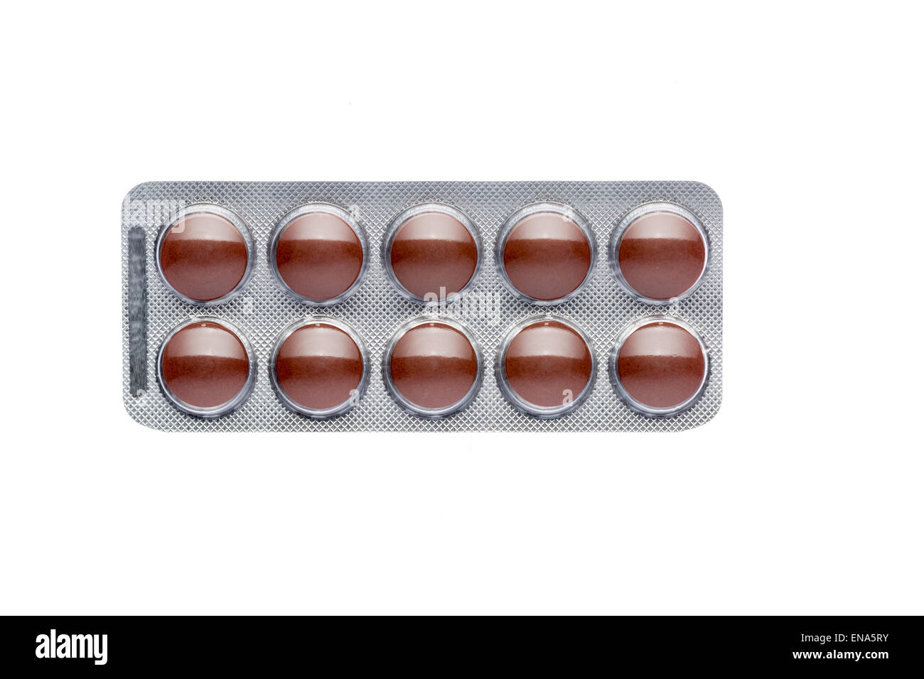 The brown pills in a blister on white background Stock Photo - Alamy