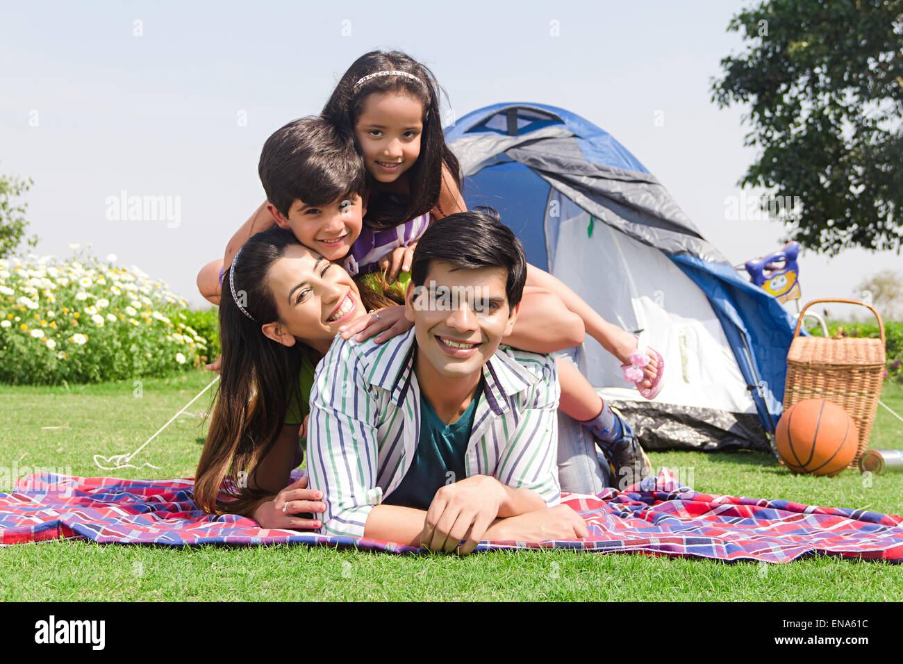 indian Parents and kids park Picnic enjoy Stock Photo - Alamy