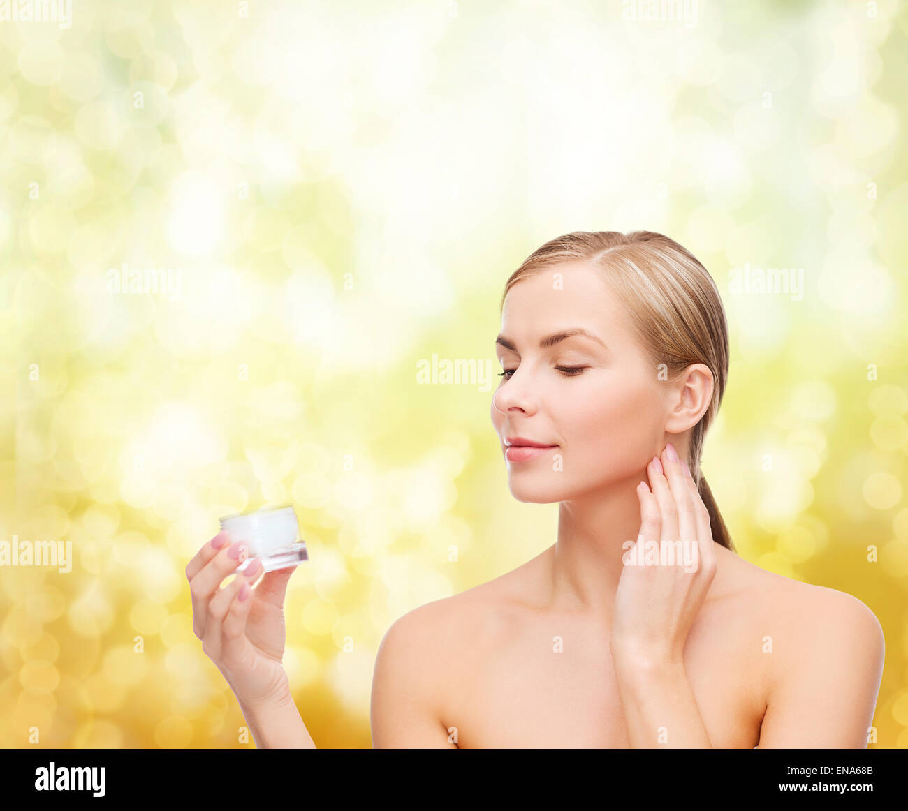 woman applying cream on her skin Stock Photo - Alamy