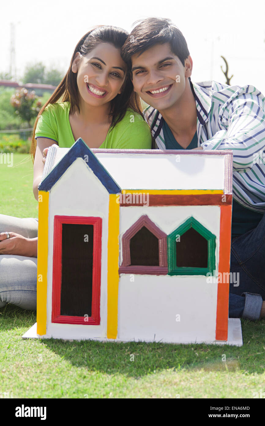 2 indian Married couples park Dummy house showing Stock Photo - Alamy