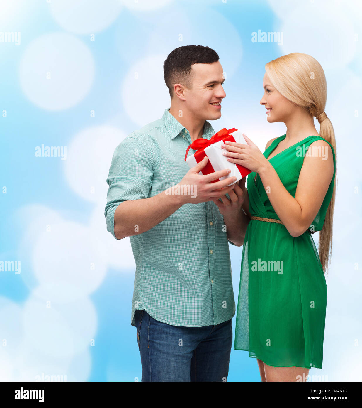 Smiling family standing blue hi-res stock photography and images - Alamy