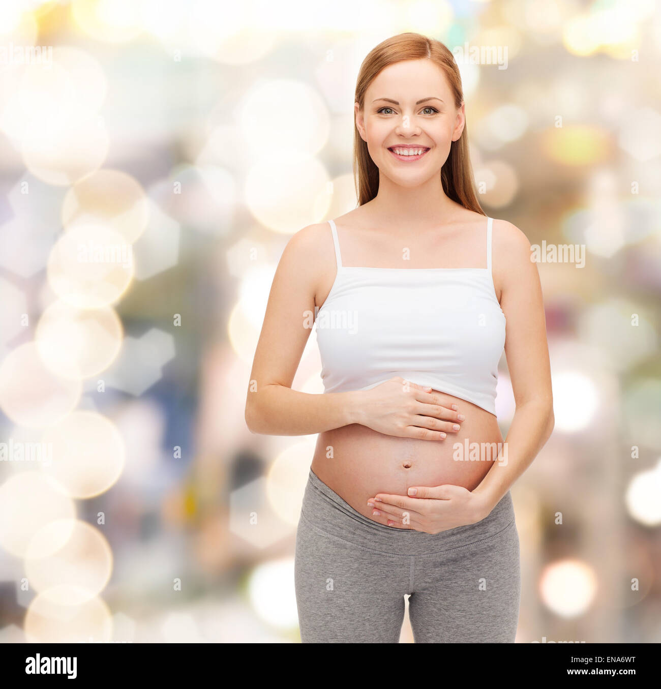 happy future mother touching her belly Stock Photo - Alamy