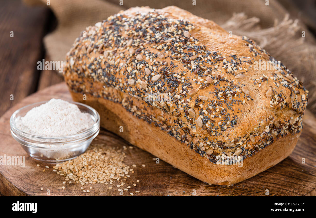 Loaf of bread (fresh baked) on rustic wooden background Stock Photo - Alamy