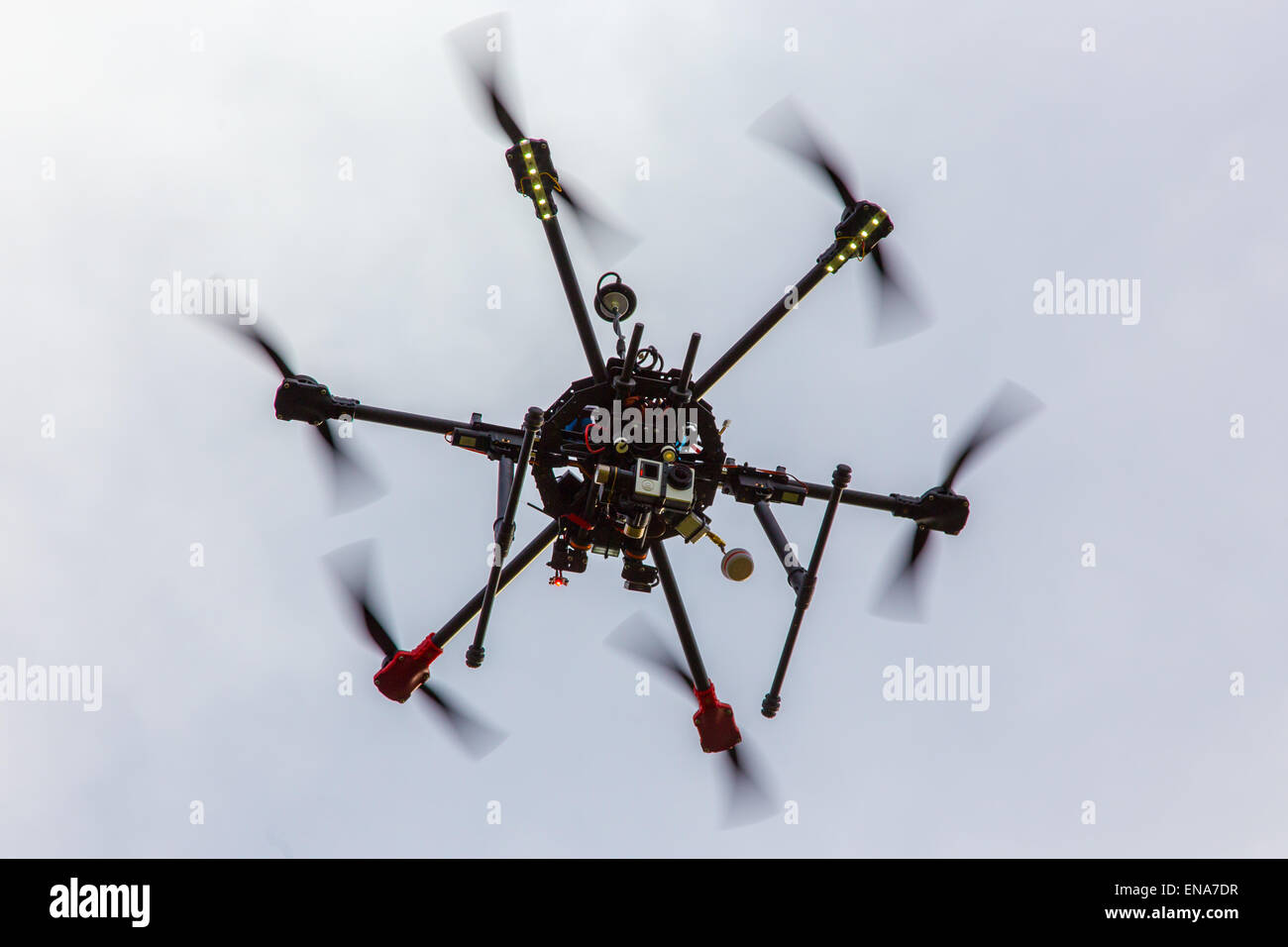 The small dron hexcopter flying over the field Stock Photo - Alamy