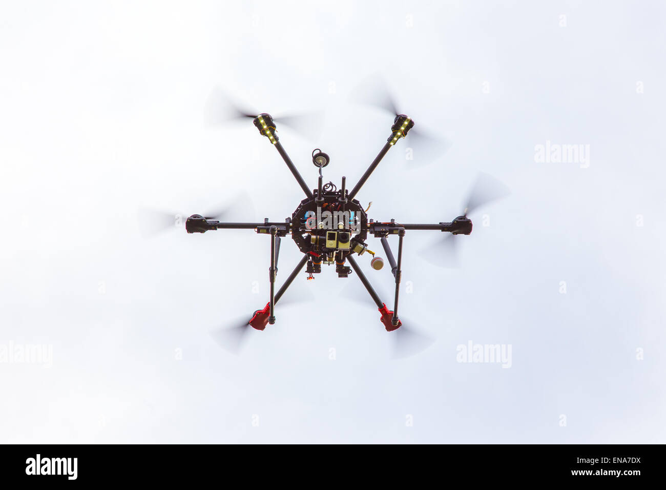 The small drone hexacopter flying over the field Stock Photo - Alamy