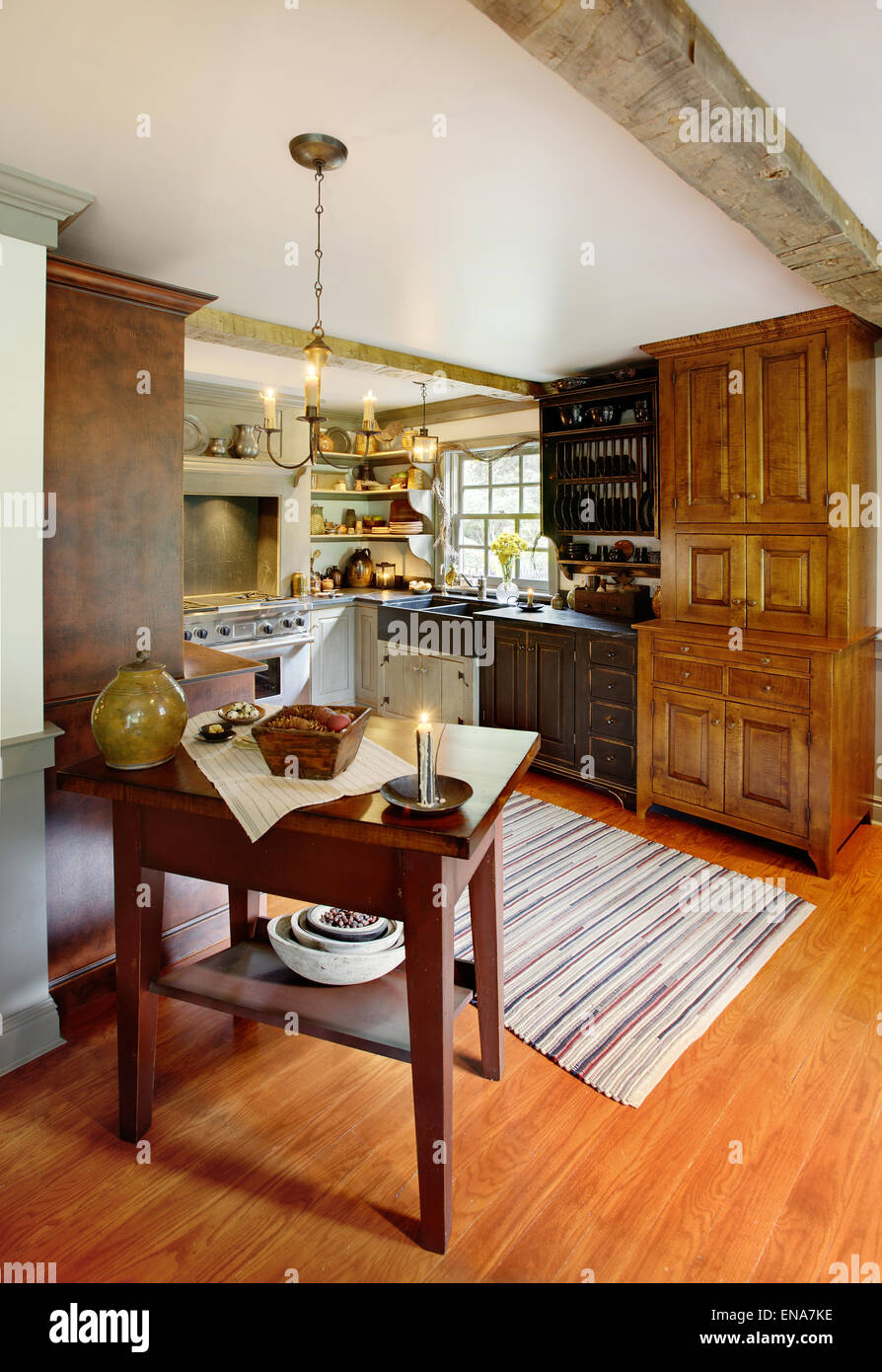 A modernized kitchen in a primitive colonial style reproduction home ...