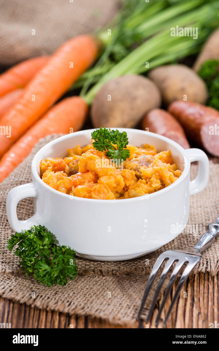 Portion of homemade Carrot Stew (on rustic wooden background Stock ...