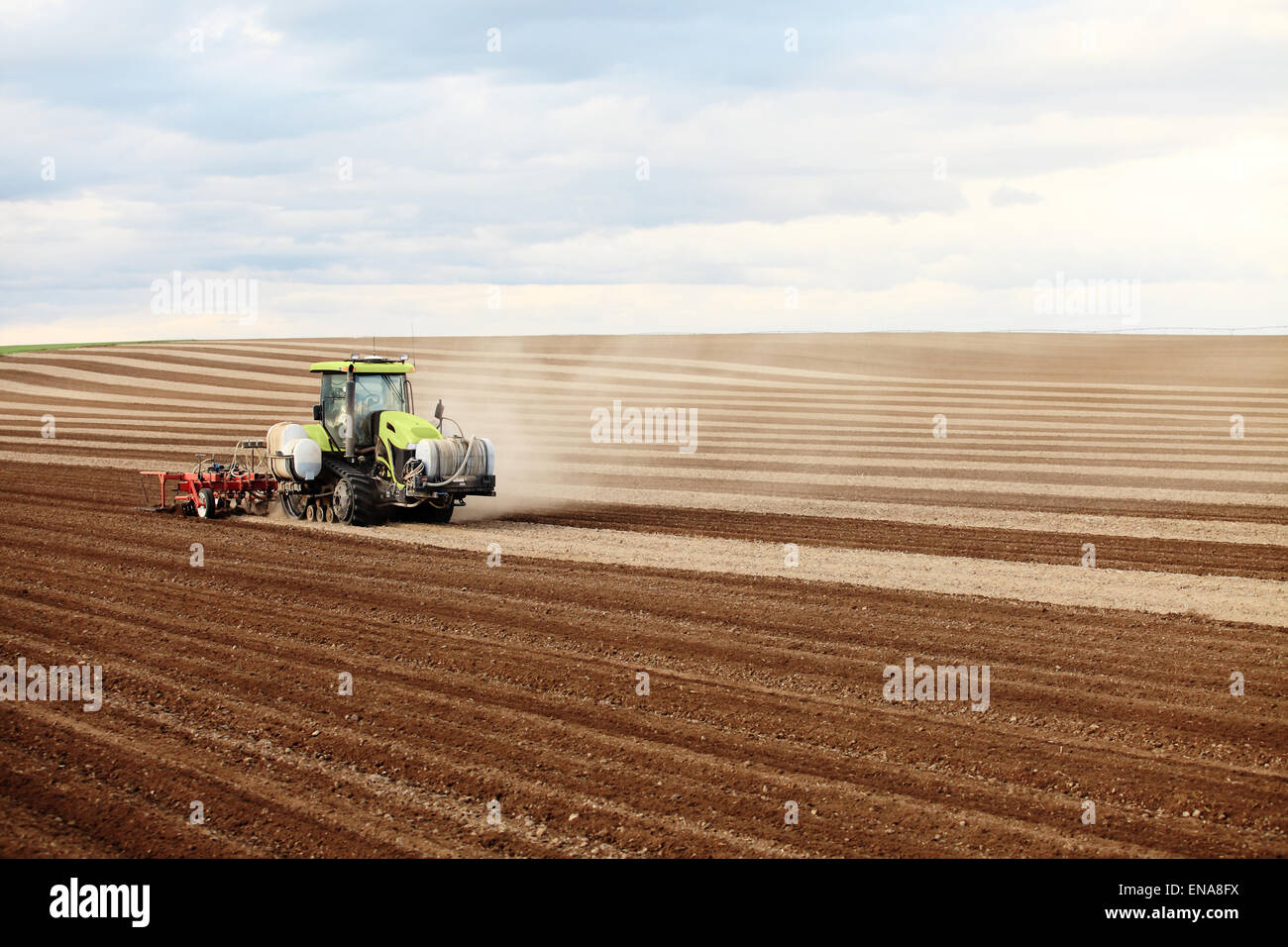 Farm machinery plowing a field Stock Photo - Alamy