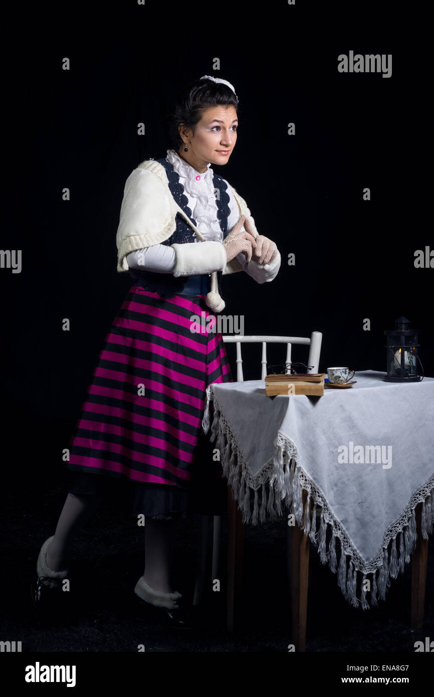 portrait of old fashioned lady standing near a tea table Stock Photo ...