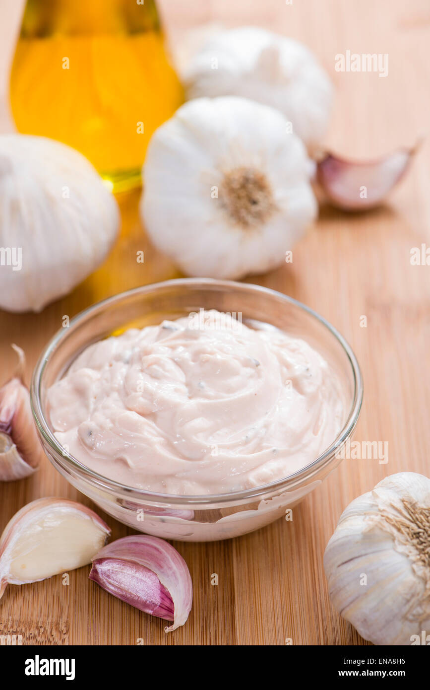 Garlic Dip (Aioli) with ingredients on wooden background Stock Photo ...