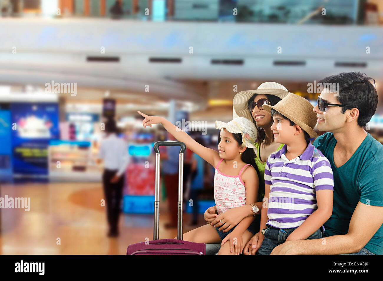 indian Parents and kids Waiting Airport showing Stock Photo - Alamy