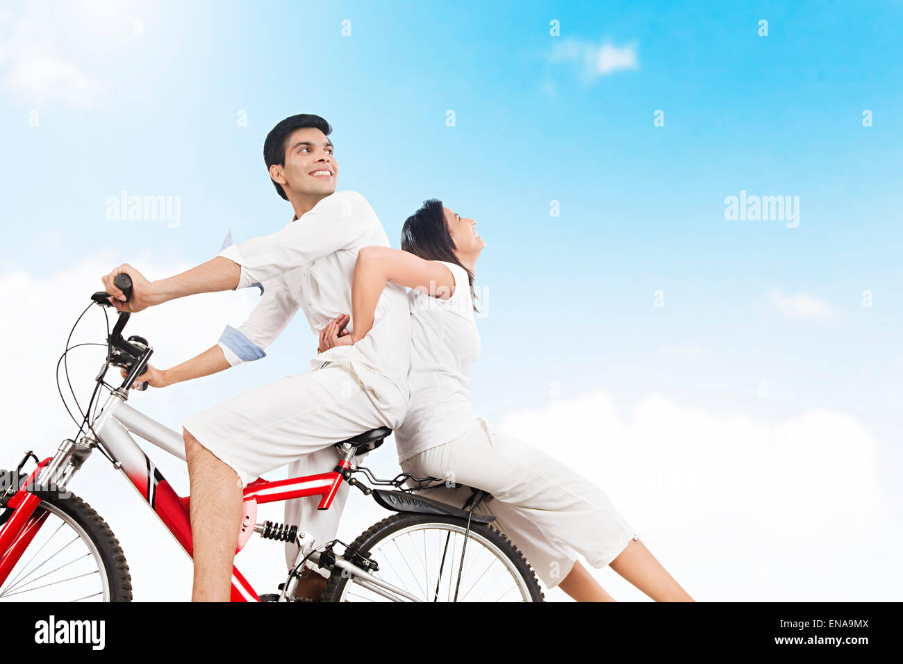Playful lovers riding bicycle hi-res stock photography and images - Alamy