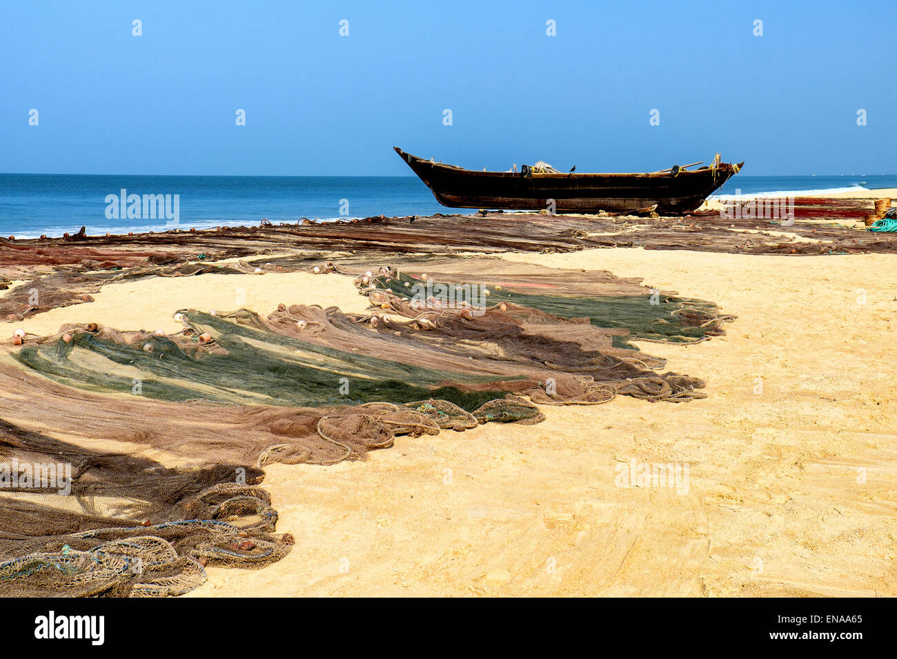 Goan Fishing boat with fishing nets in the foreground on Cavelossim ...
