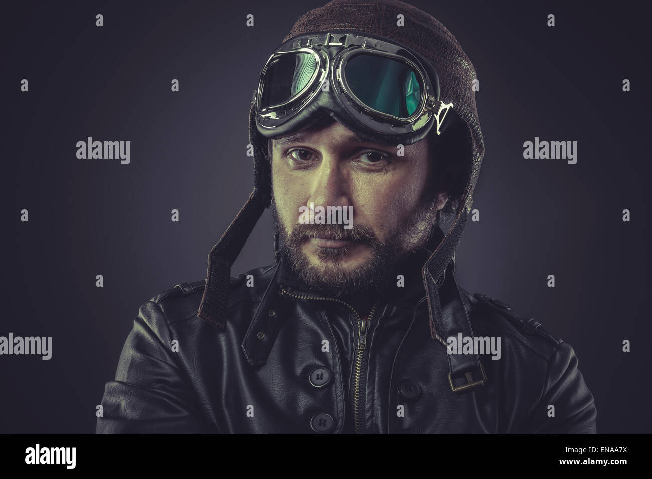 steampunk pilot dressed in vintage style leather cap and goggles Stock ...
