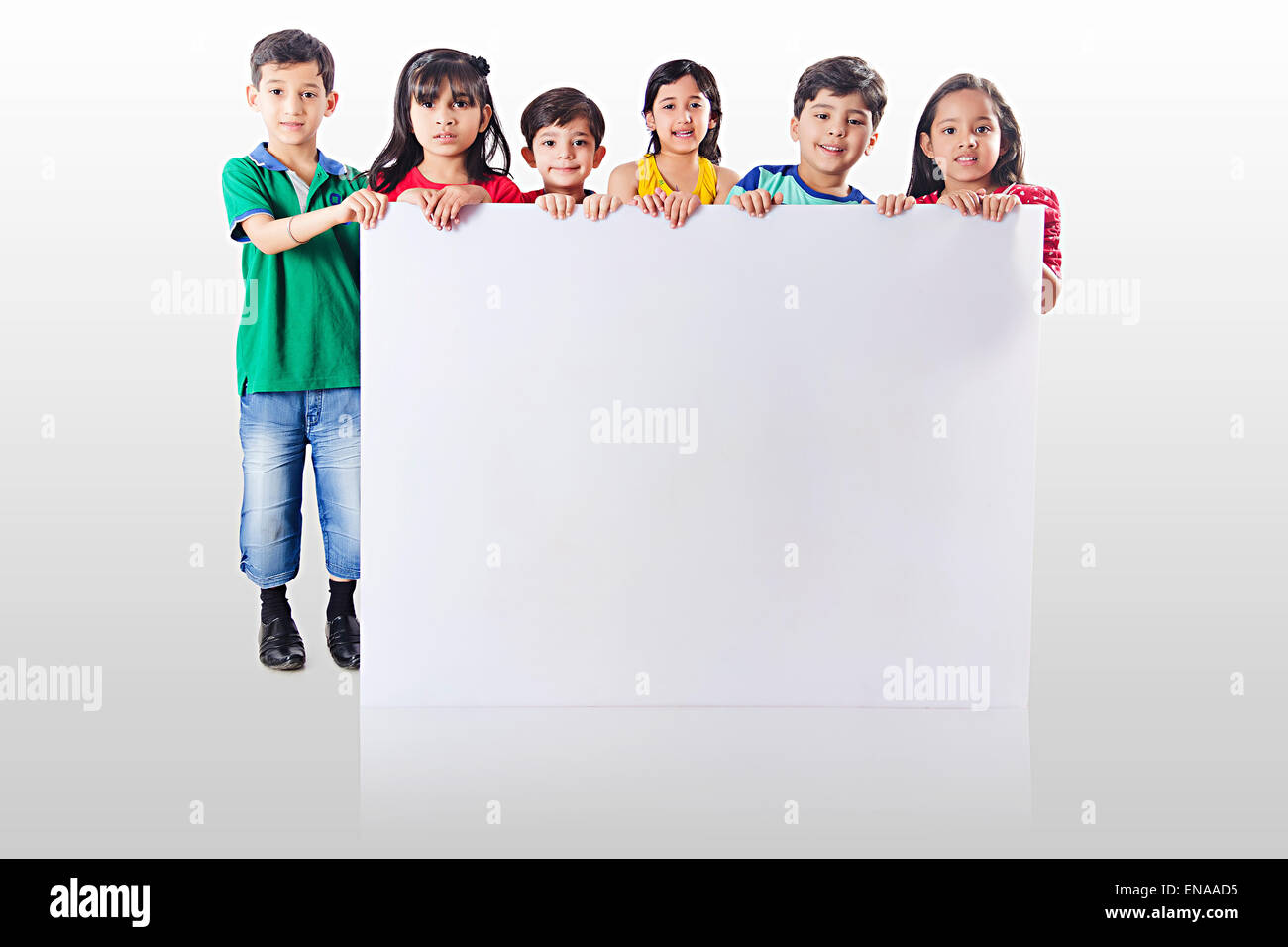 indian Kids groups Friends Showing Message Board Stock Photo - Alamy