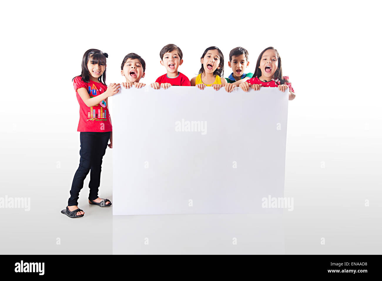 indian Kids groups Friends Showing Message Board Stock Photo - Alamy