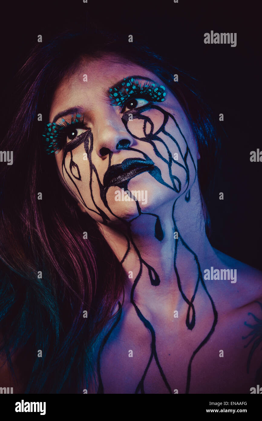 violence concept, crying woman with tears and makeup dark light Stock ...