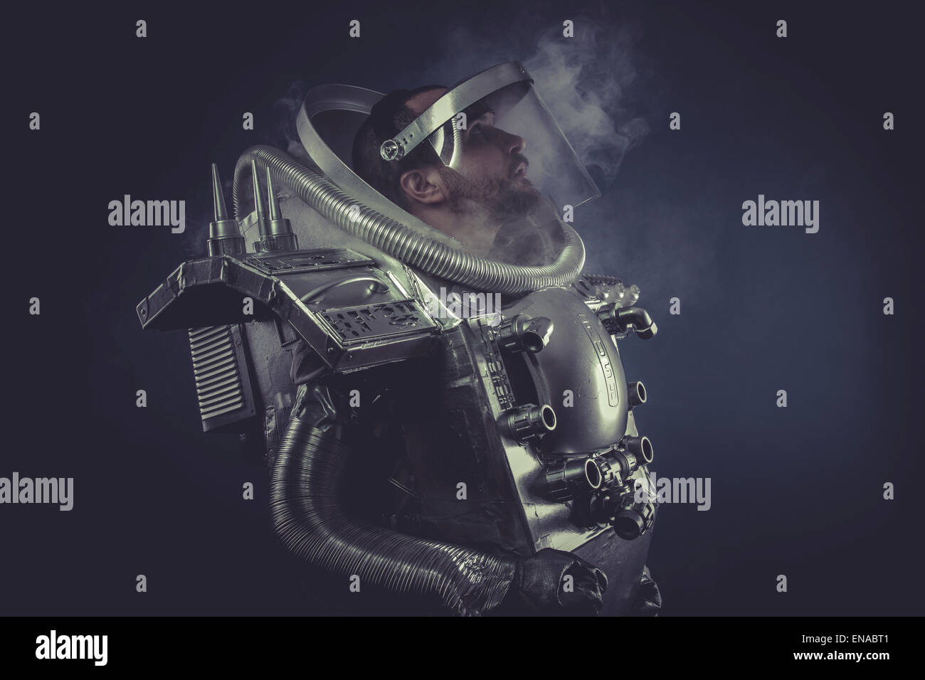 spaceman in silver armor and huge cannon Stock Photo - Alamy