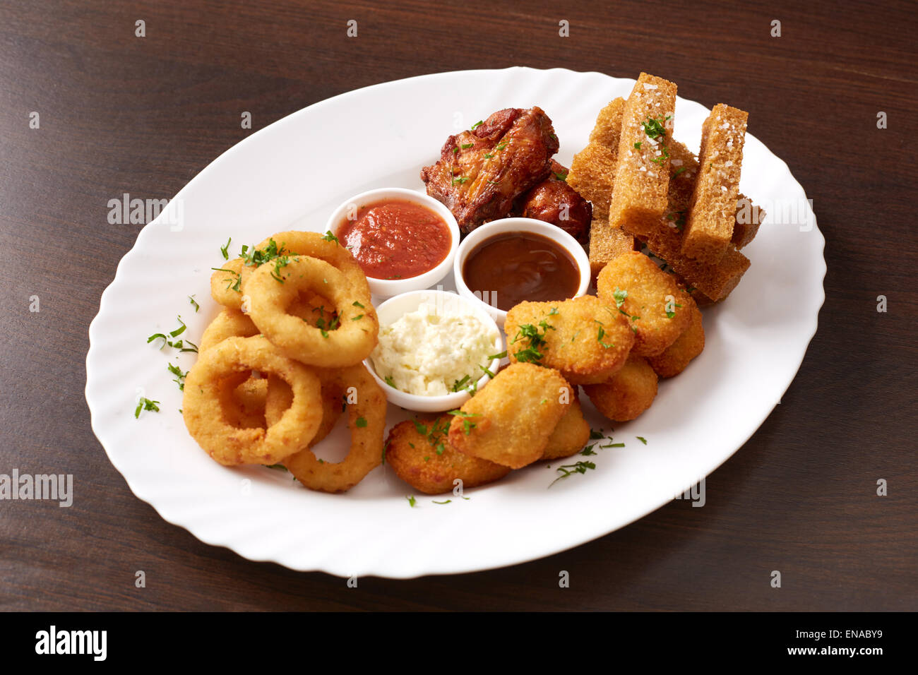 Fast food. Dish with snacks and sauces, close-up Stock Photo - Alamy
