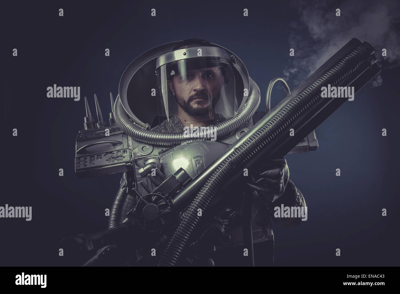 galaxy, spaceman in silver armor and huge cannon Stock Photo - Alamy