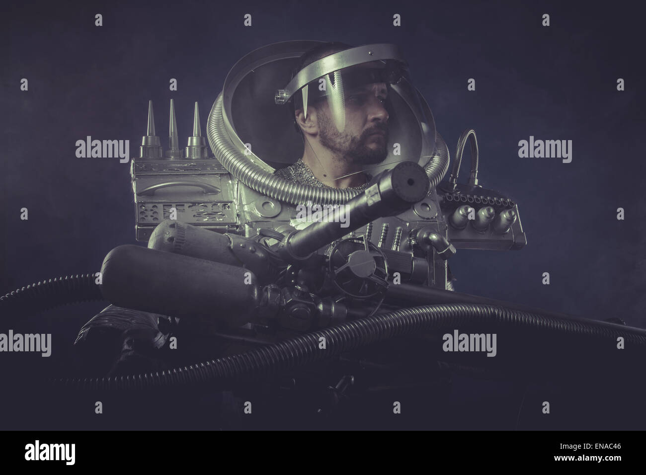 fx, spaceman in silver armor and huge cannon Stock Photo - Alamy