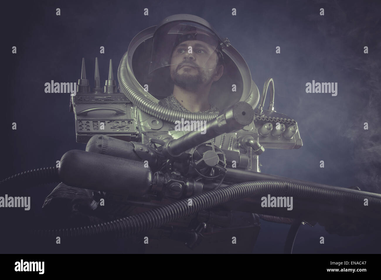 pilot, spaceman in silver armor and huge cannon Stock Photo - Alamy