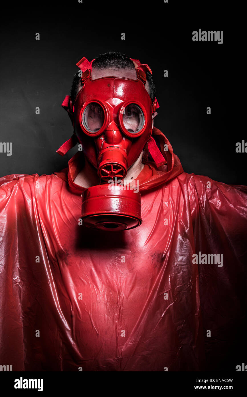 emission nuclear concept, man with red gas mask Stock Photo - Alamy