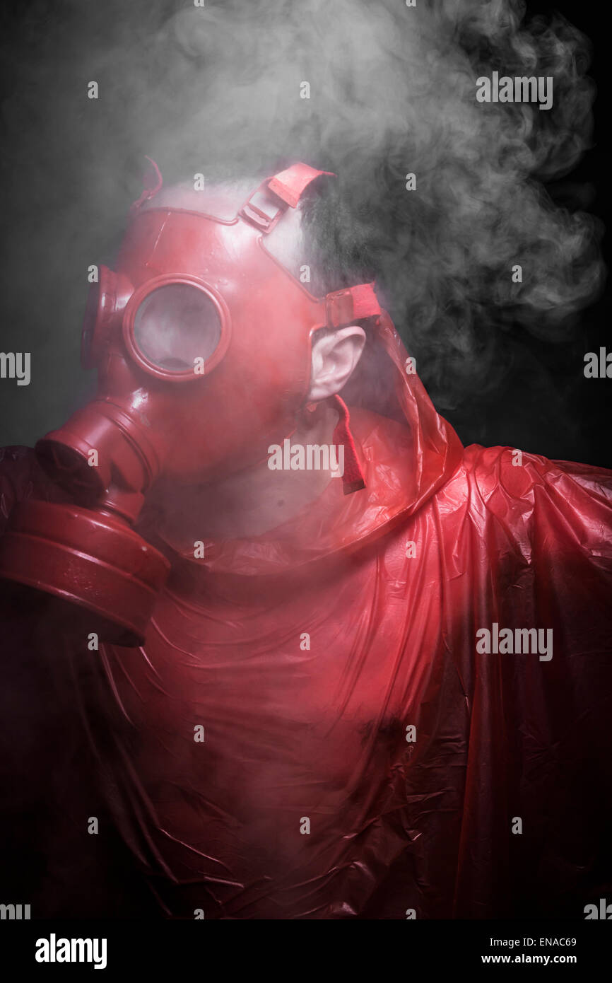 Destruction, A man in a gas mask over the smoke. black background and ...