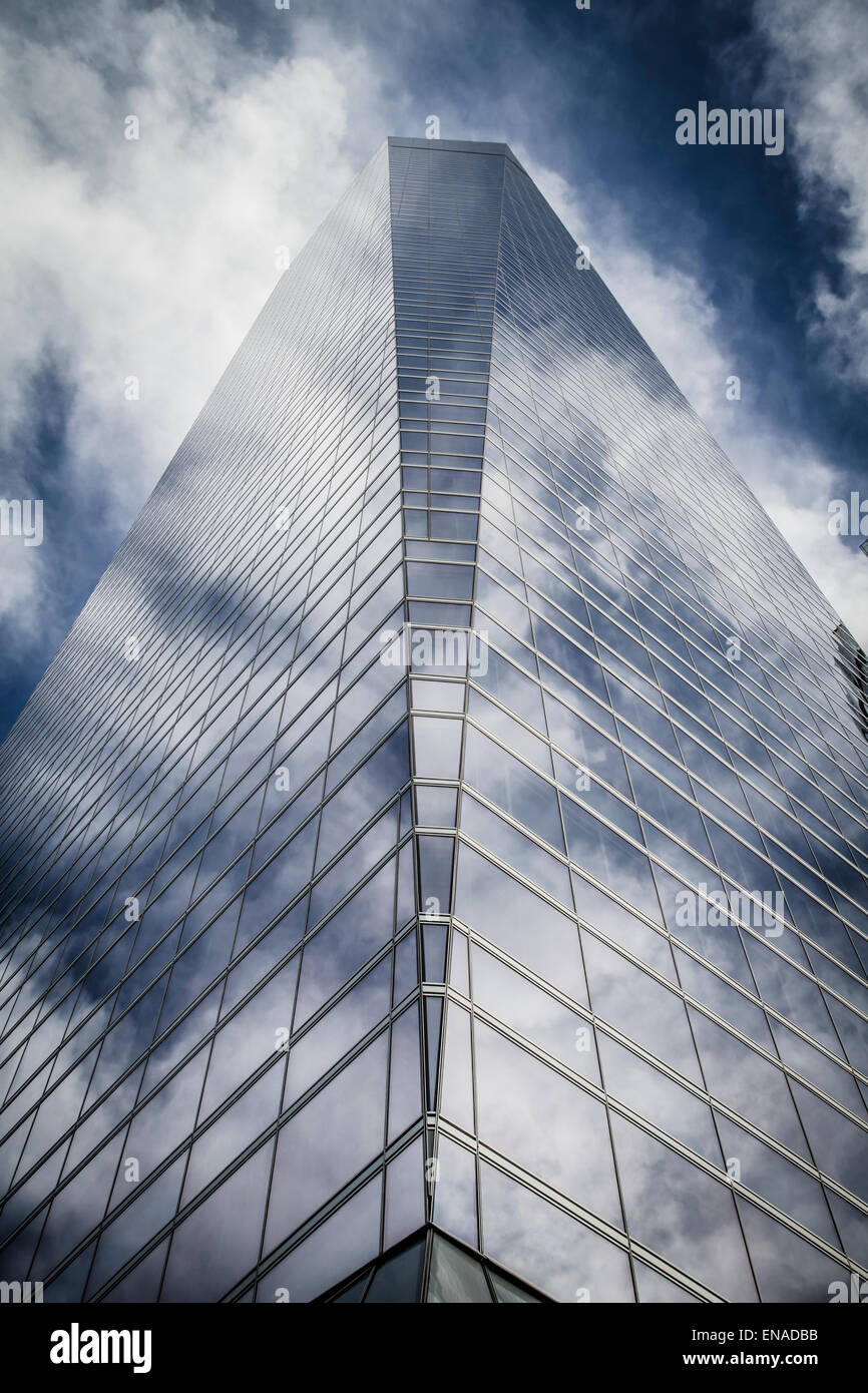 enterprise, skyscraper with glass facade and clouds reflected in ...
