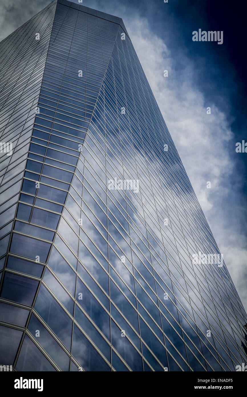 business, skyscraper with glass facade and clouds reflected in windows ...