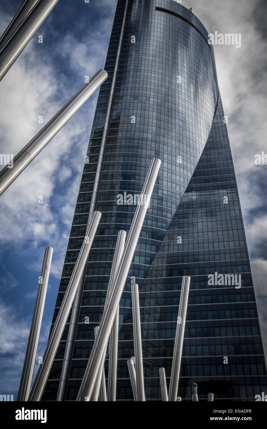 financial, skyscraper with glass facade and clouds reflected in windows ...