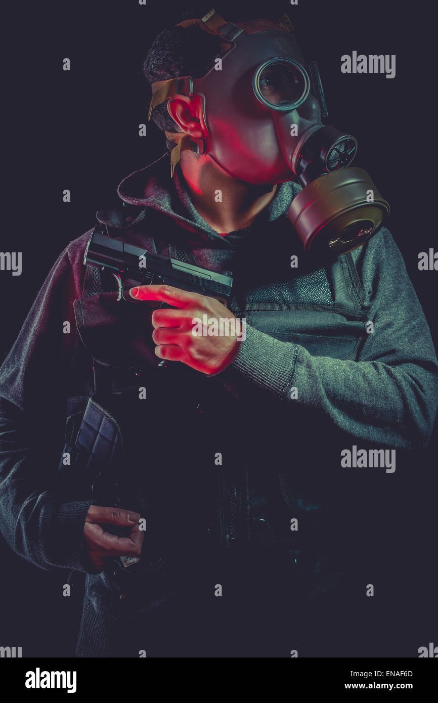 Man with gas mask and gun Stock Photo - Alamy