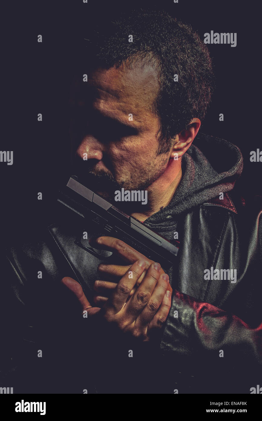 Robber with gun. Man in suit draws vintage handgun Stock Photo - Alamy