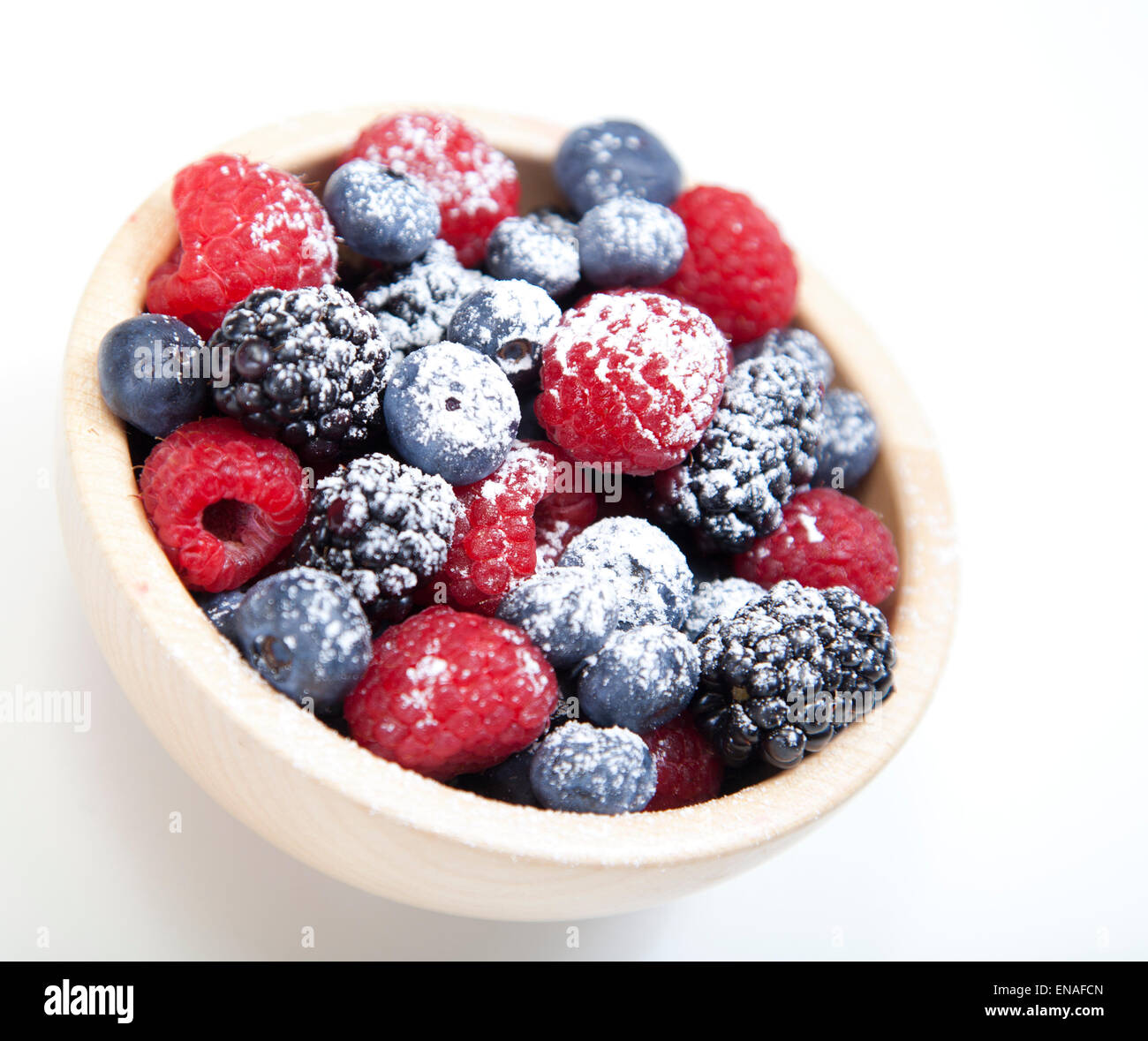 Assorted mixed berries in a bowl isolated on white Stock Photo - Alamy