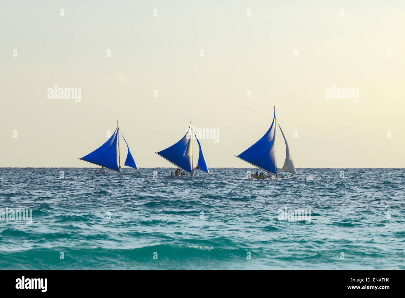 Three sailing boats on sunset tropical sea, Philippines Boracay island ...