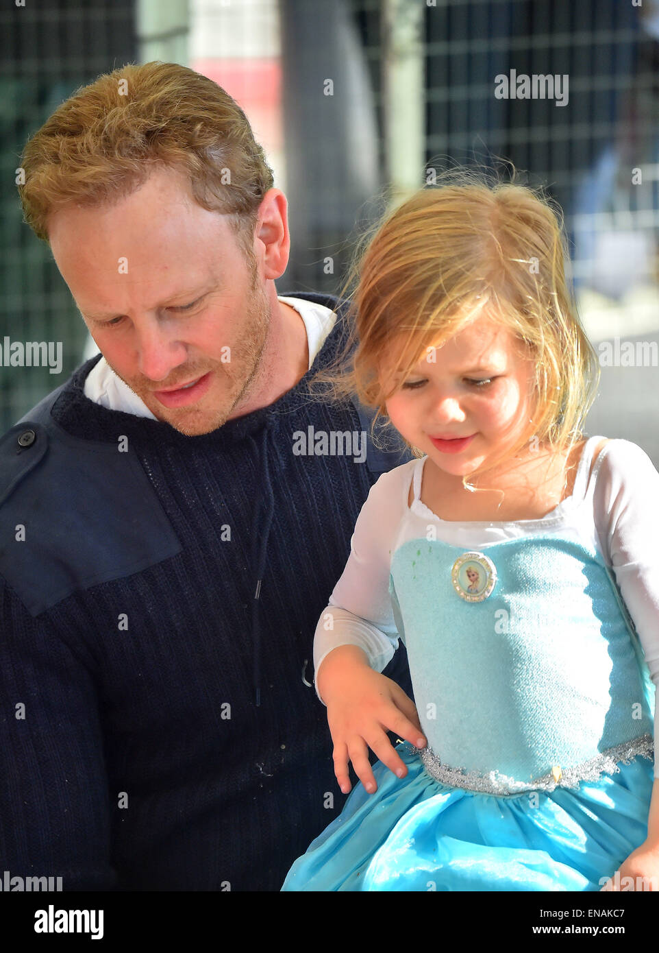 Ian Ziering and his two daughters play with the rabbits at the Farmer's ...