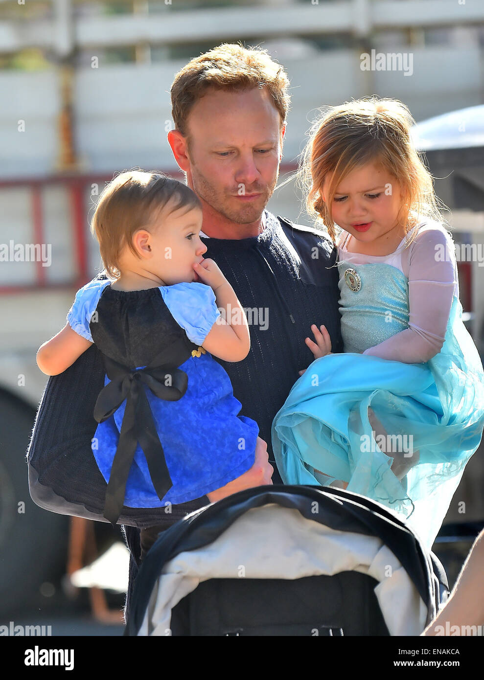 Ian Ziering and his two daughters play with the rabbits at the Farmer's ...