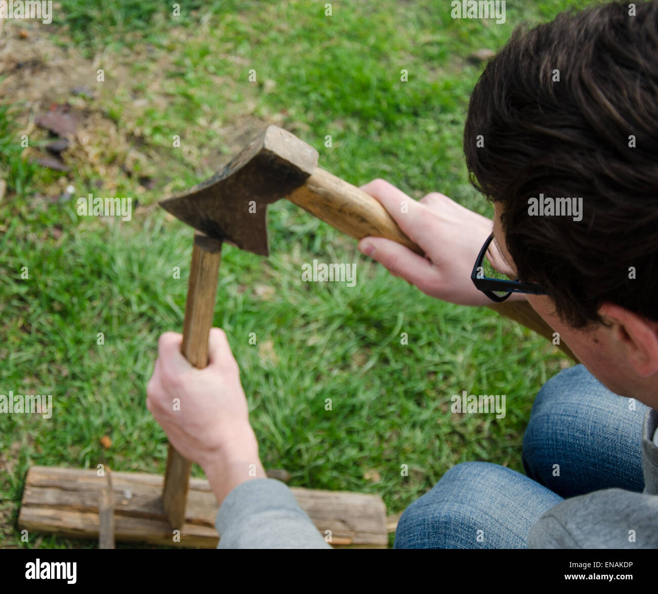 Axe in the hand Stock Photo - Alamy