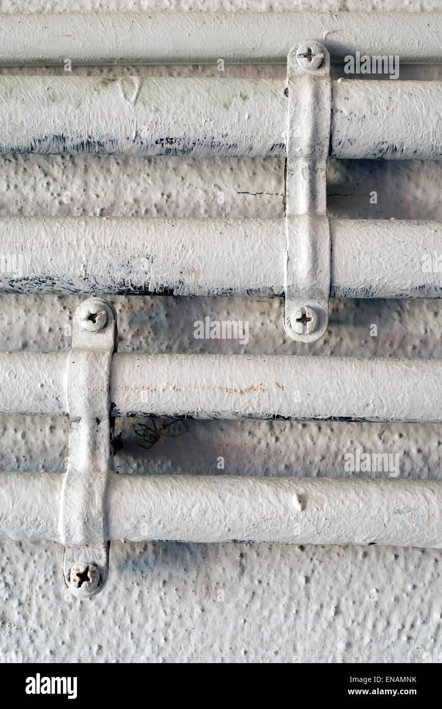 gas pipes painted white Stock Photo - Alamy