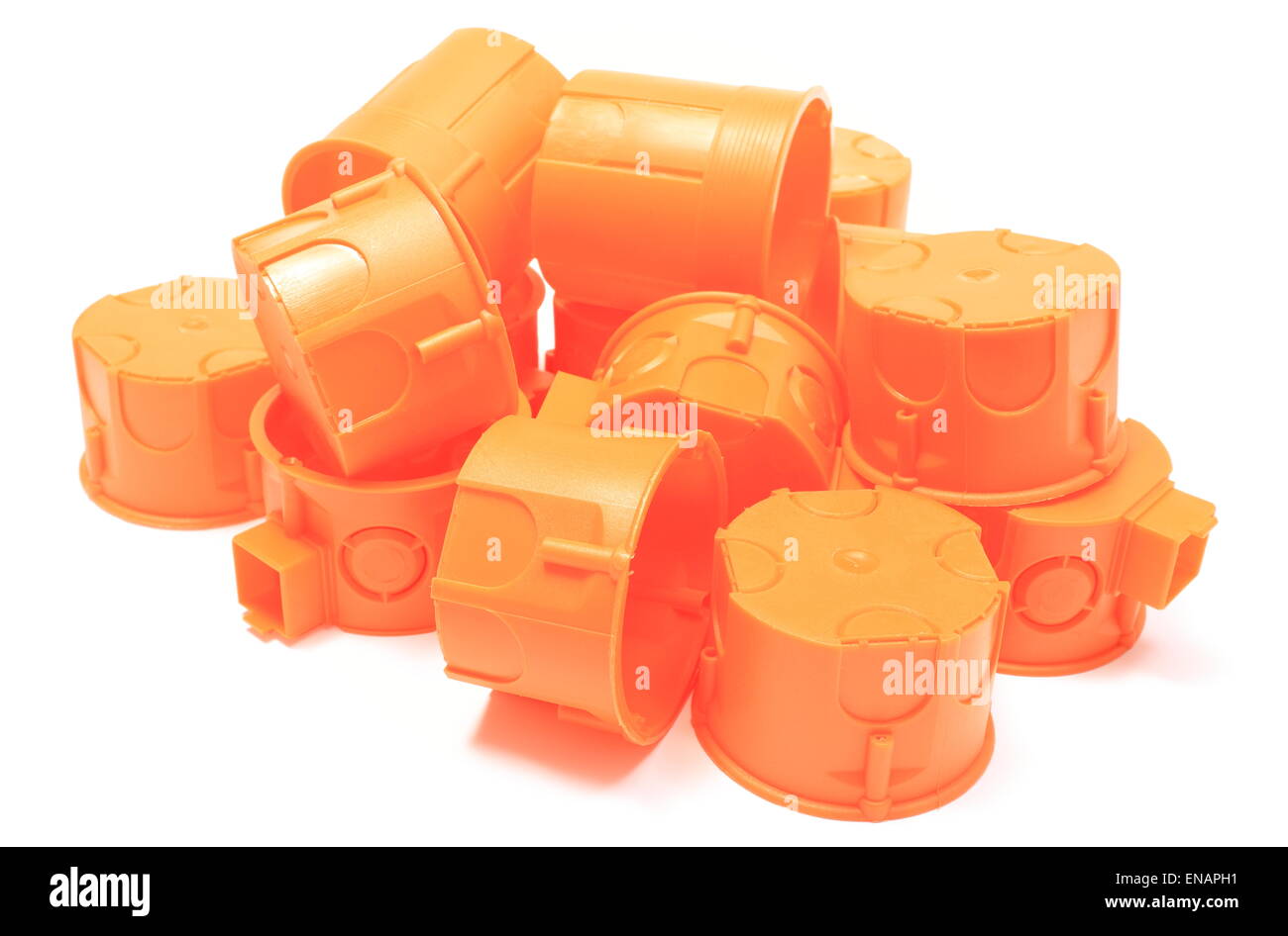 Heap of orange plastic electrical boxes on white background, junction ...