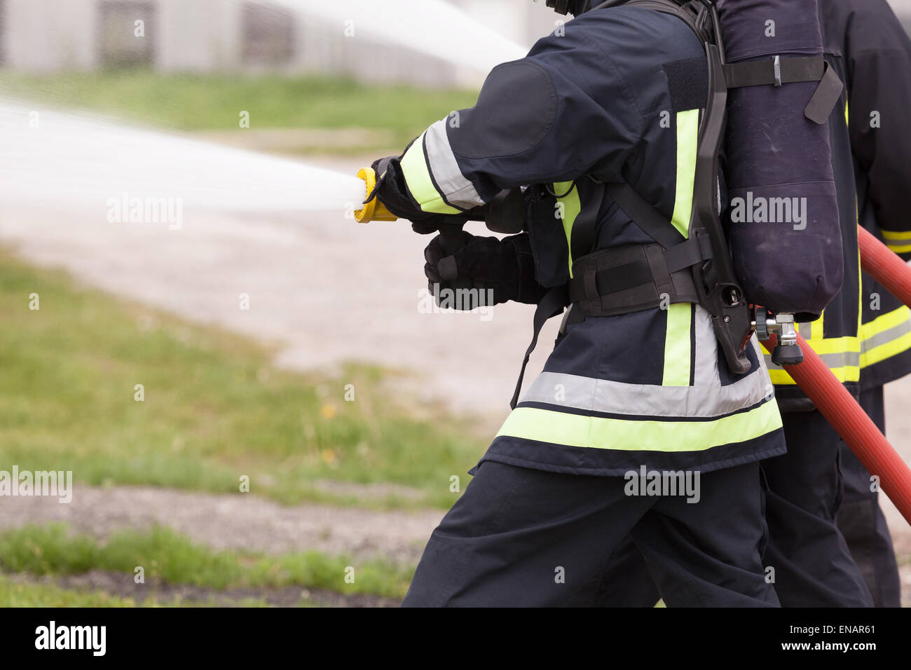 firefighters in action Stock Photo - Alamy