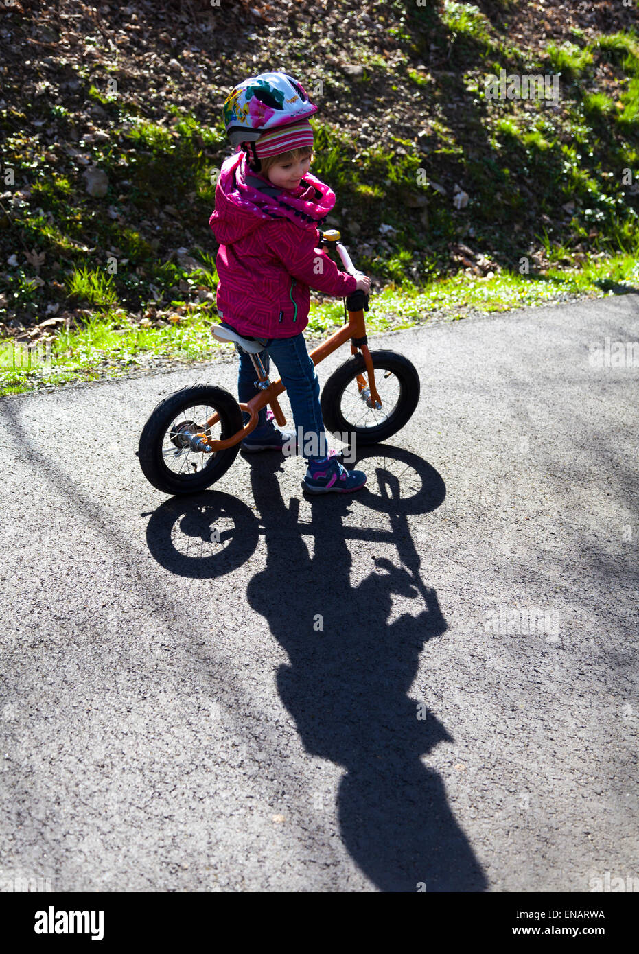 Shadow girl riding bike hi-res stock photography and images - Alamy