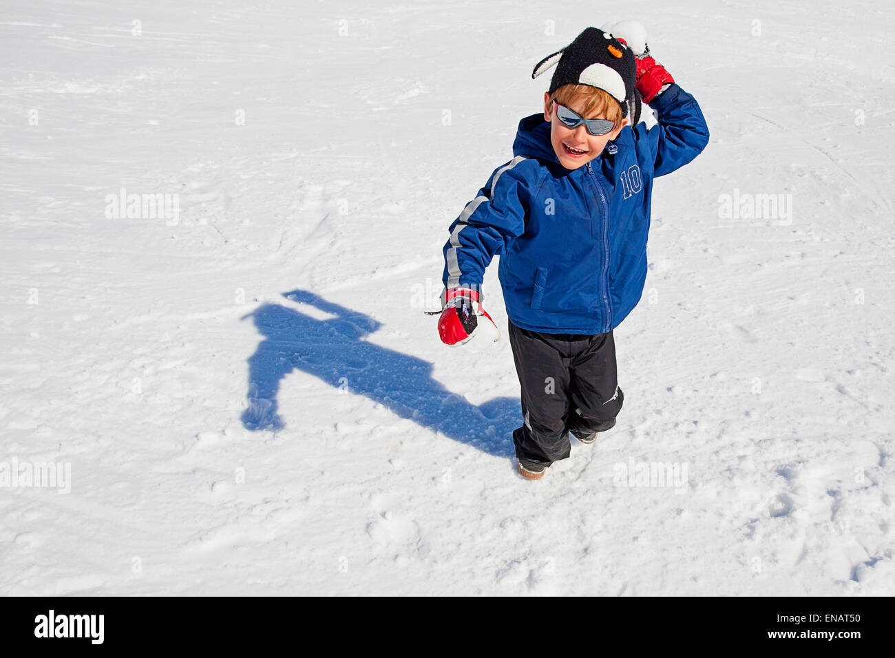 Boy with snowball hi-res stock photography and images - Alamy